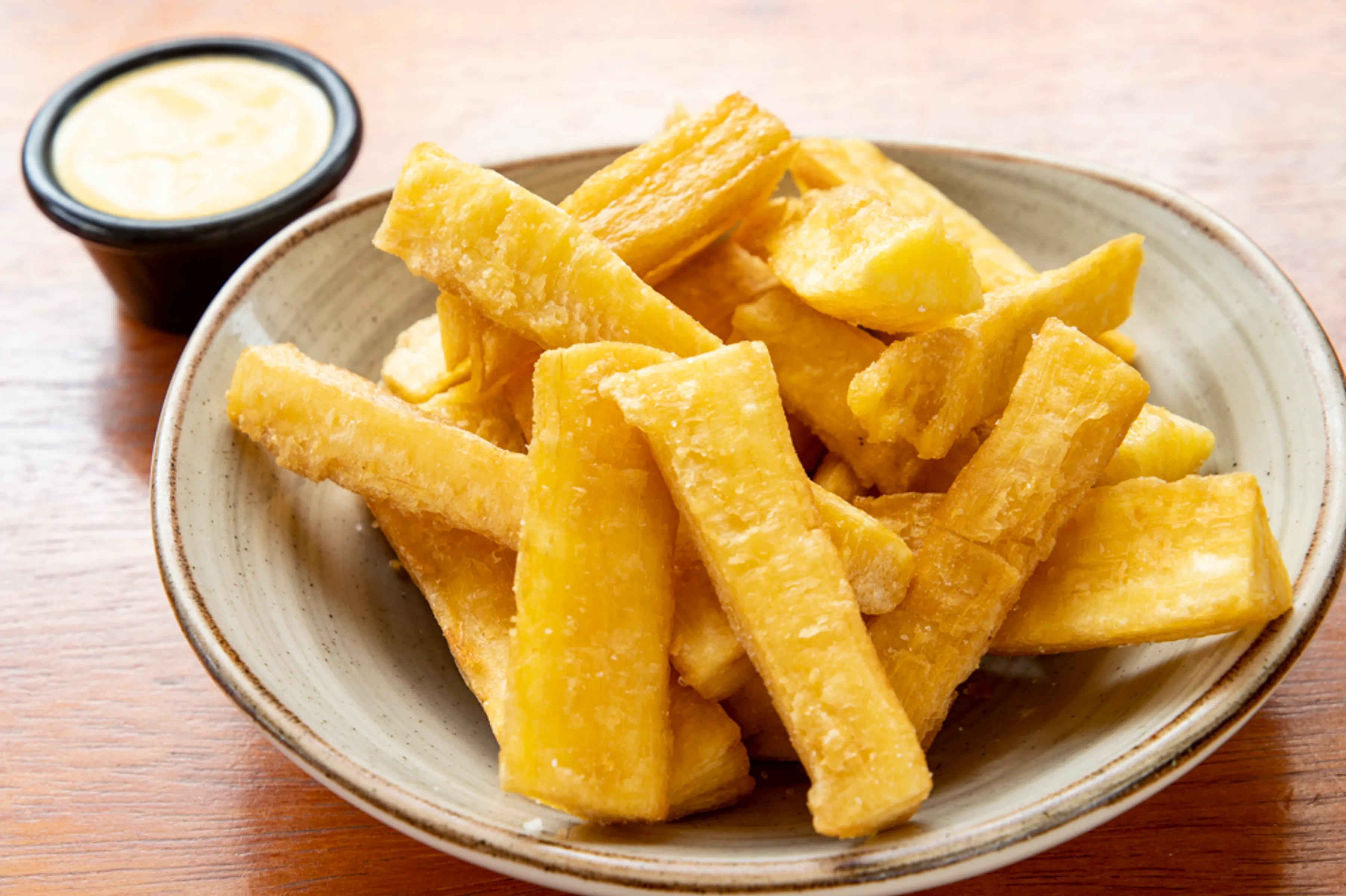 Yuquitas fritas con salsa huancaína - TANTA - Restaurante peruano